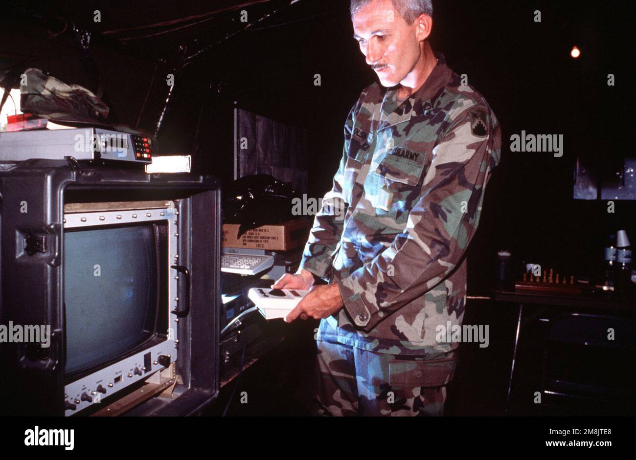 SGT. 1ST Class Owen Olgen works on a Network Management Central (NHC) A ...