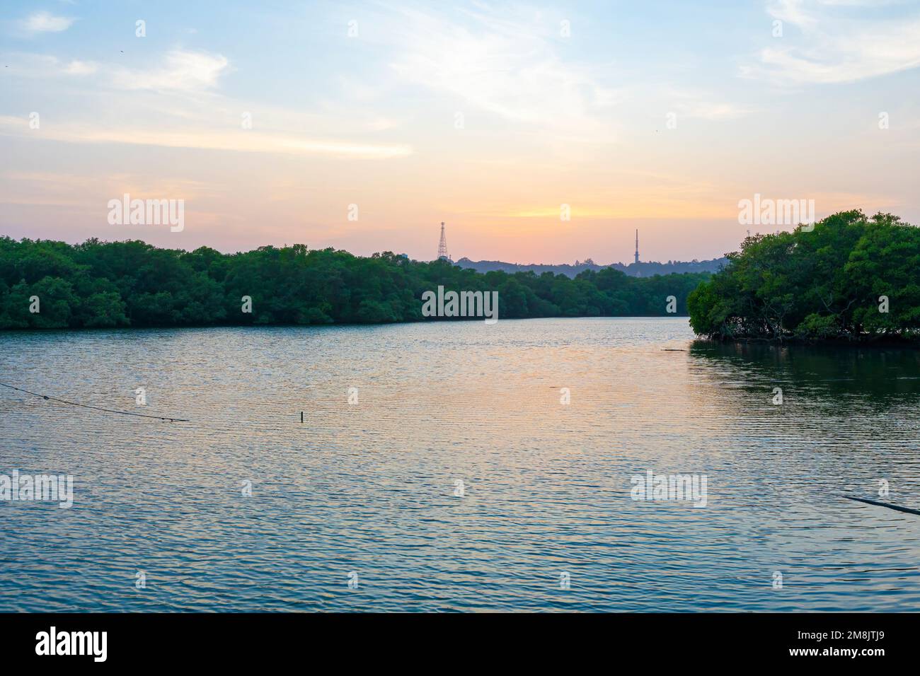 A beautiful sunset with a colorful sky above a river is a sight to ...