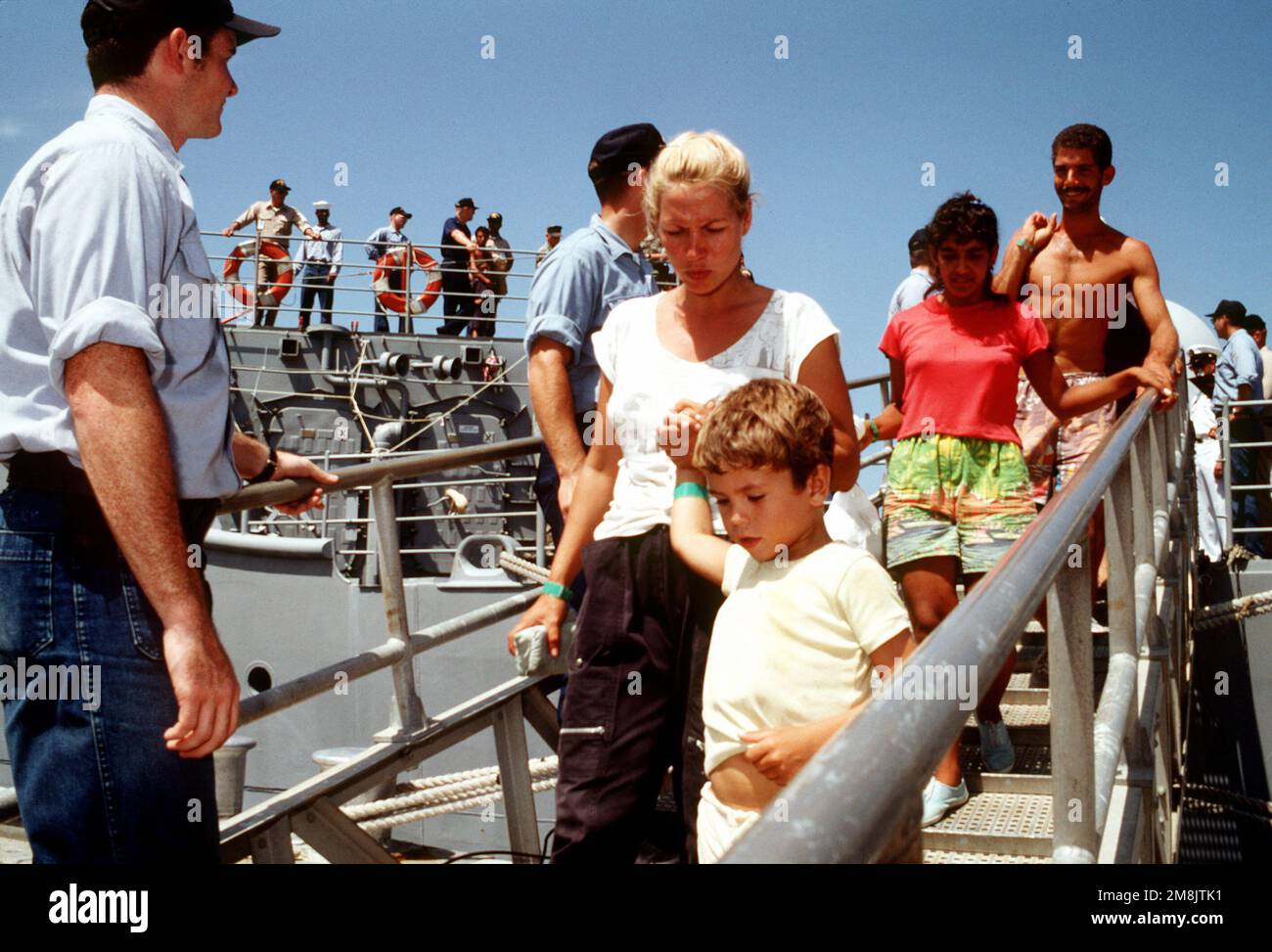 Cuban migrants disembark the USS VICKSBURG (CG-69) at the safe haven in ...