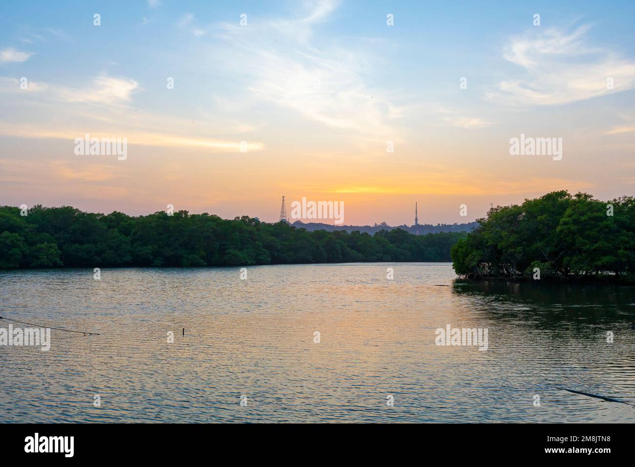 A beautiful sunset with a colorful sky above a river is a sight to ...