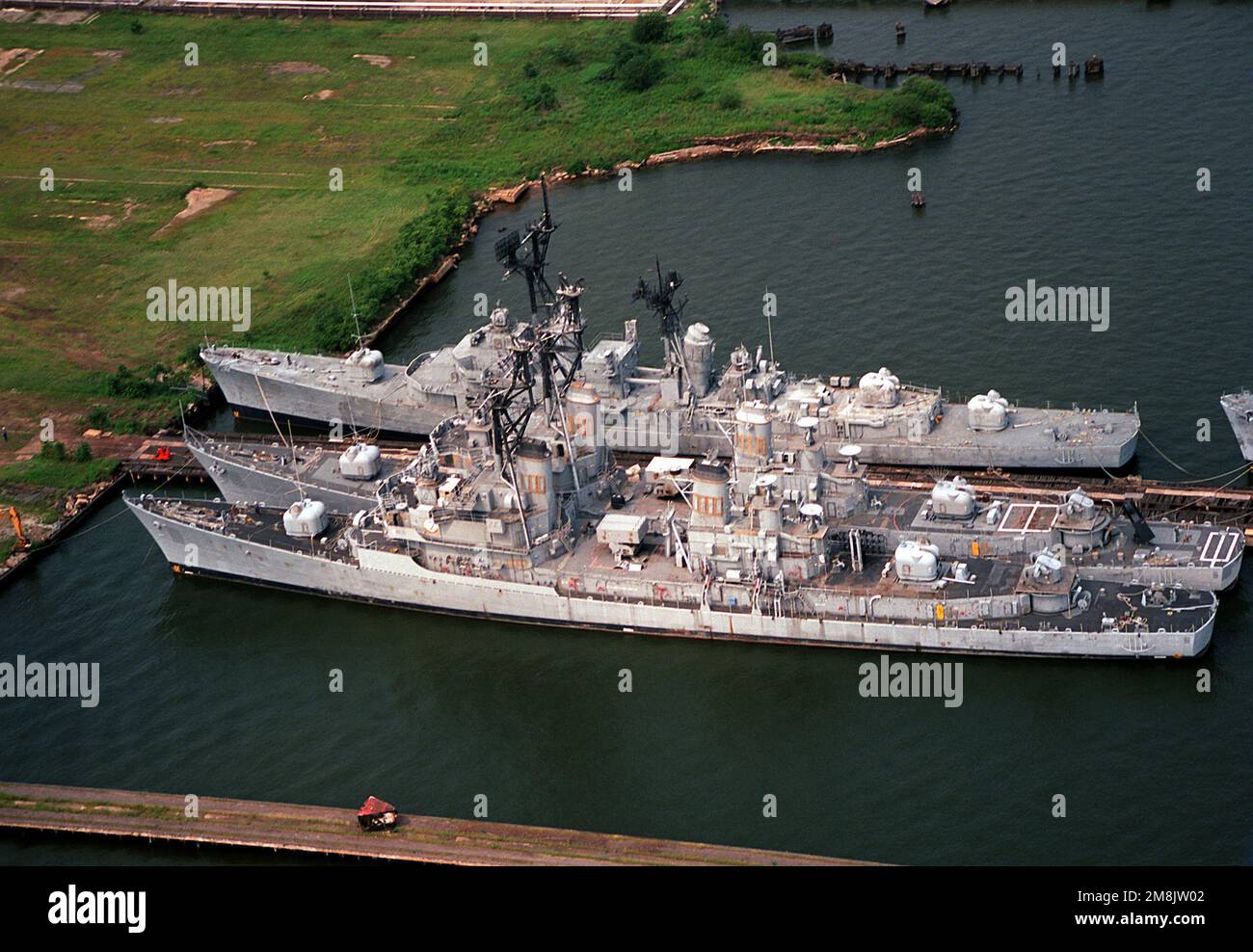 An aerial port side view of two Adams-class guided missile destroyers ...