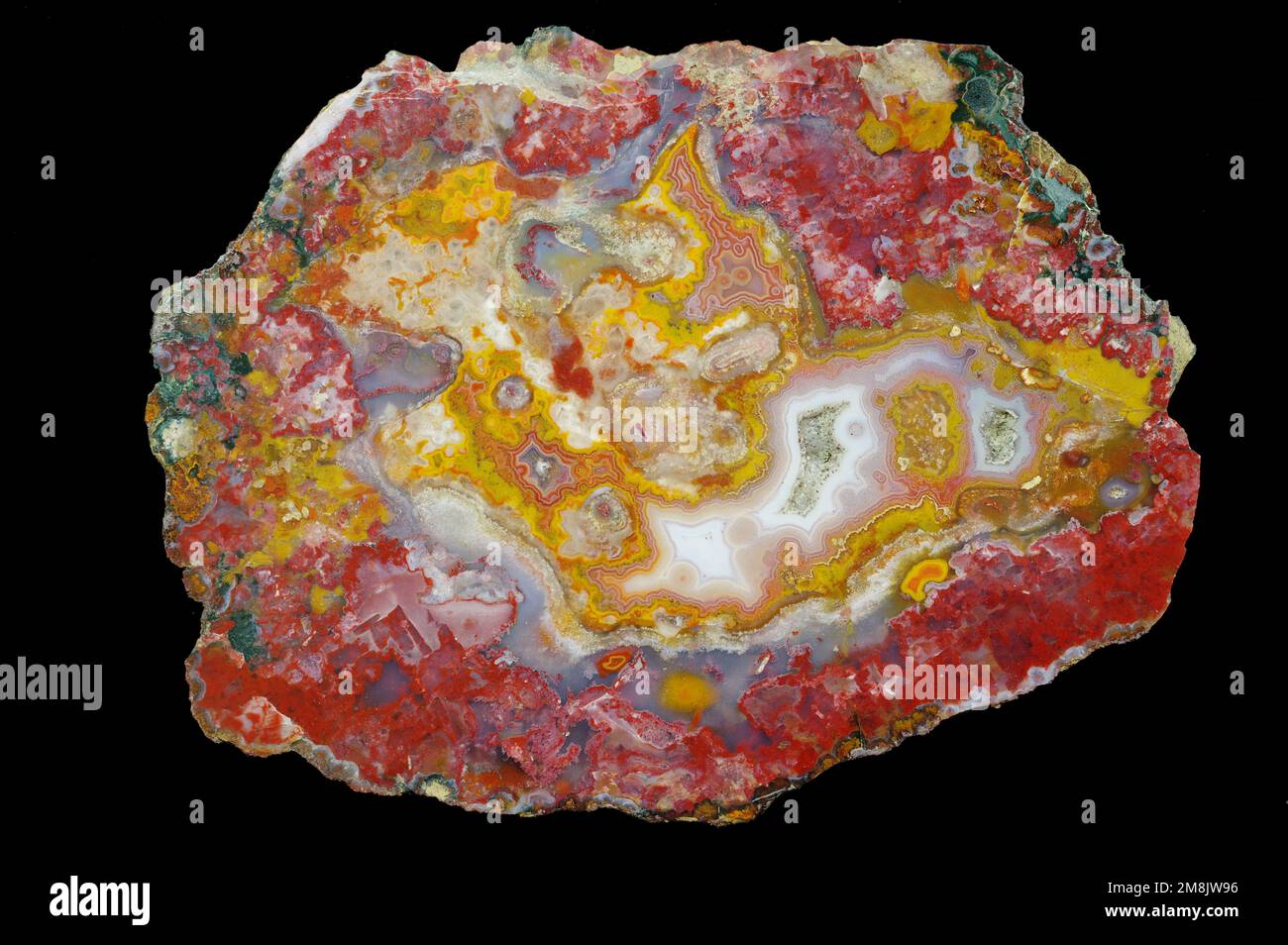 A cross section of the agate stone with quartz geode. Multicolored ...