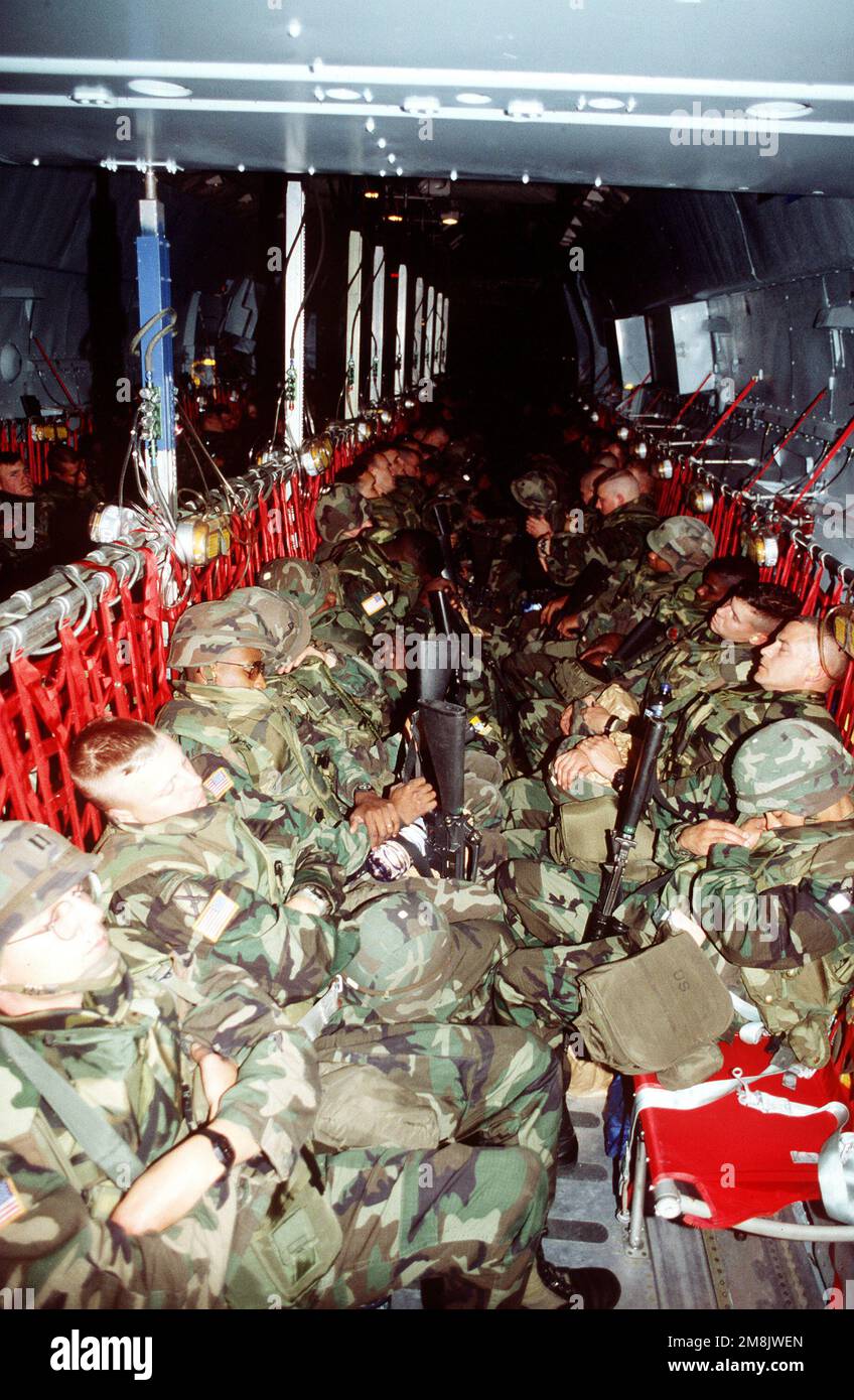 The 10th Mountain Division troops on board a C-141 get rest before they ...