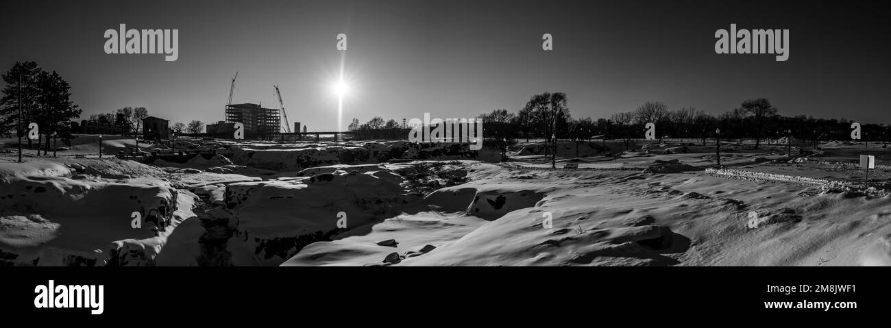 Sioux Falls Park during winter with frozen waterfall and snow cover ...