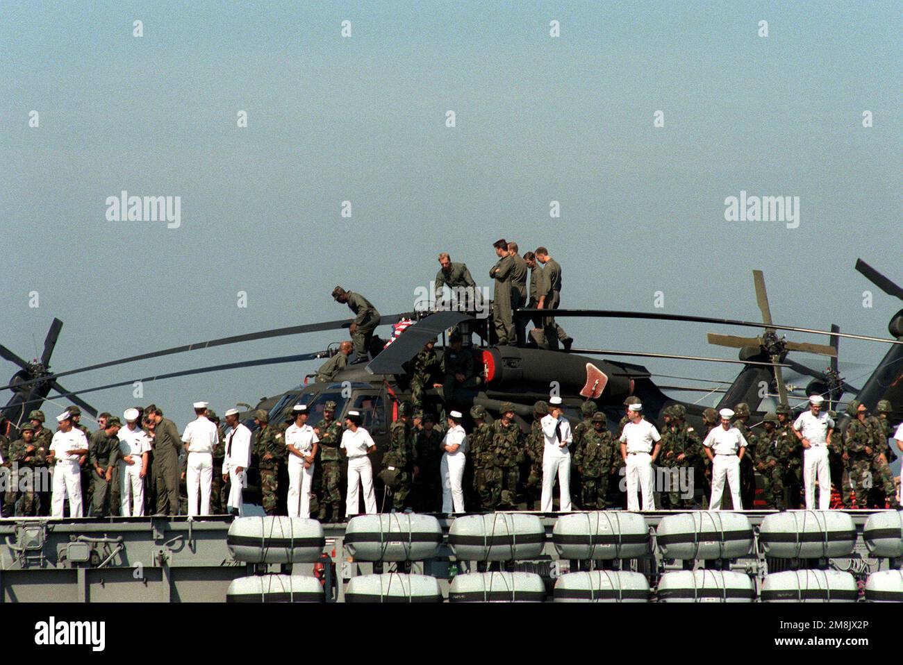 Members of the U.S. Army's 10th Mountain Division and crew members of ...
