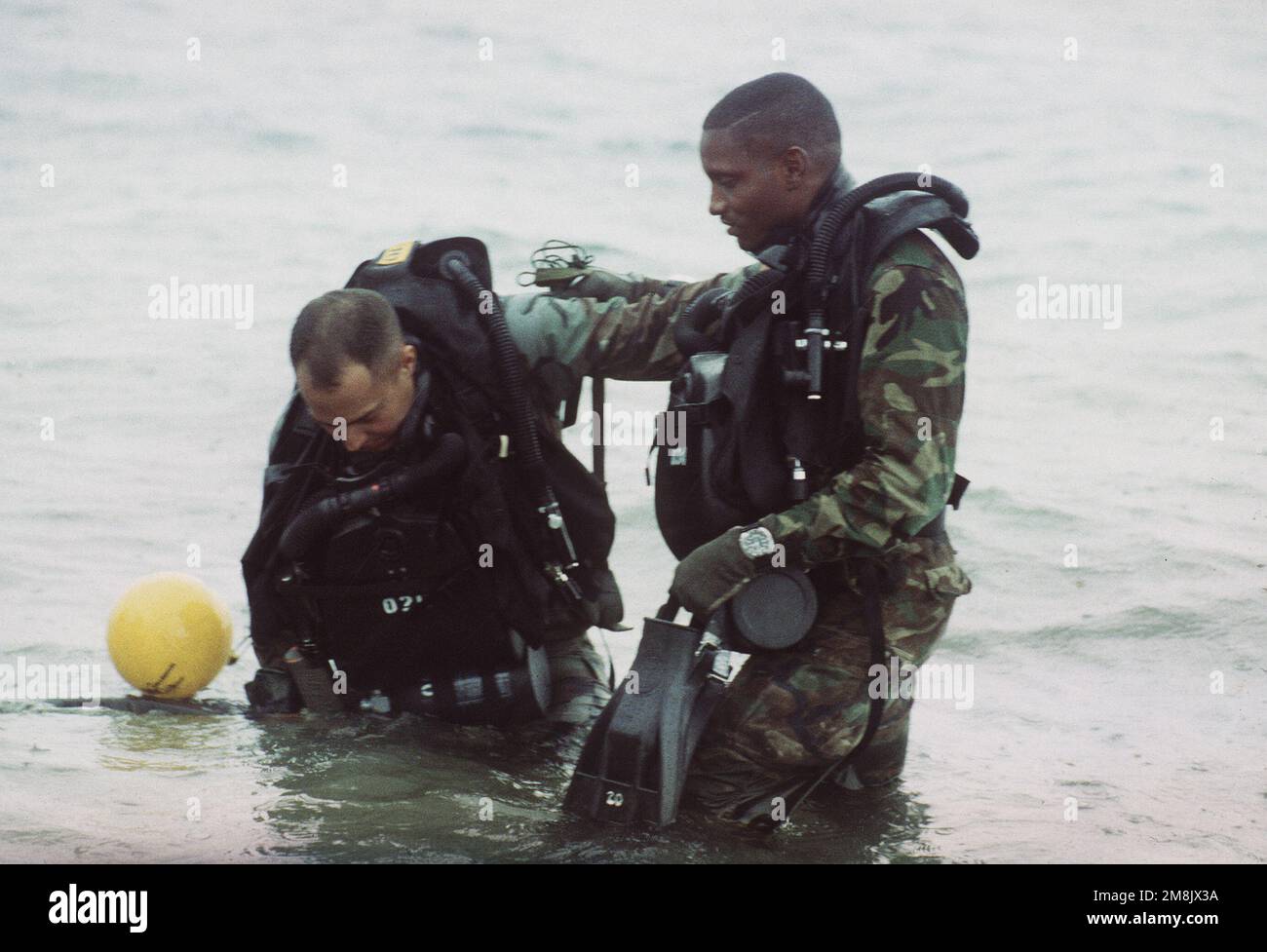 STAFF SGT. Martinez (left) and STAFF SGT. Long enter the waters at ...