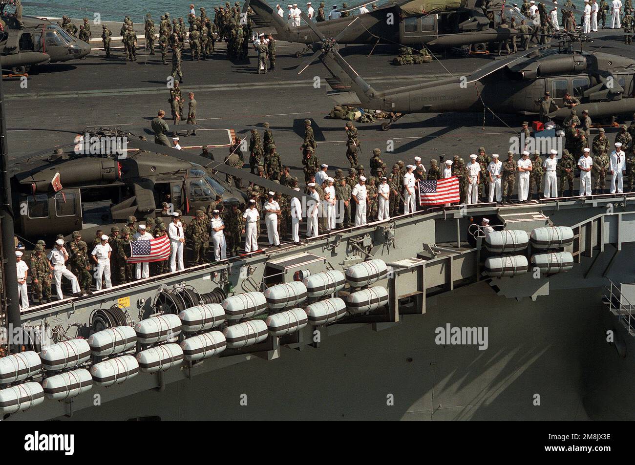 Manning the rails of the nuclear-powered aircraft carrier USS DWIGHT D ...