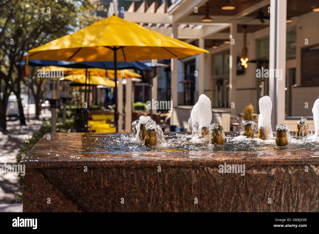 Fountain with yellow umbrellas outdoor seating for customers from The ...