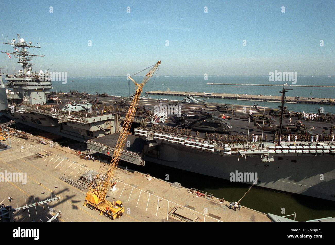 A large crane has completed removing the gang plank from the side of ...