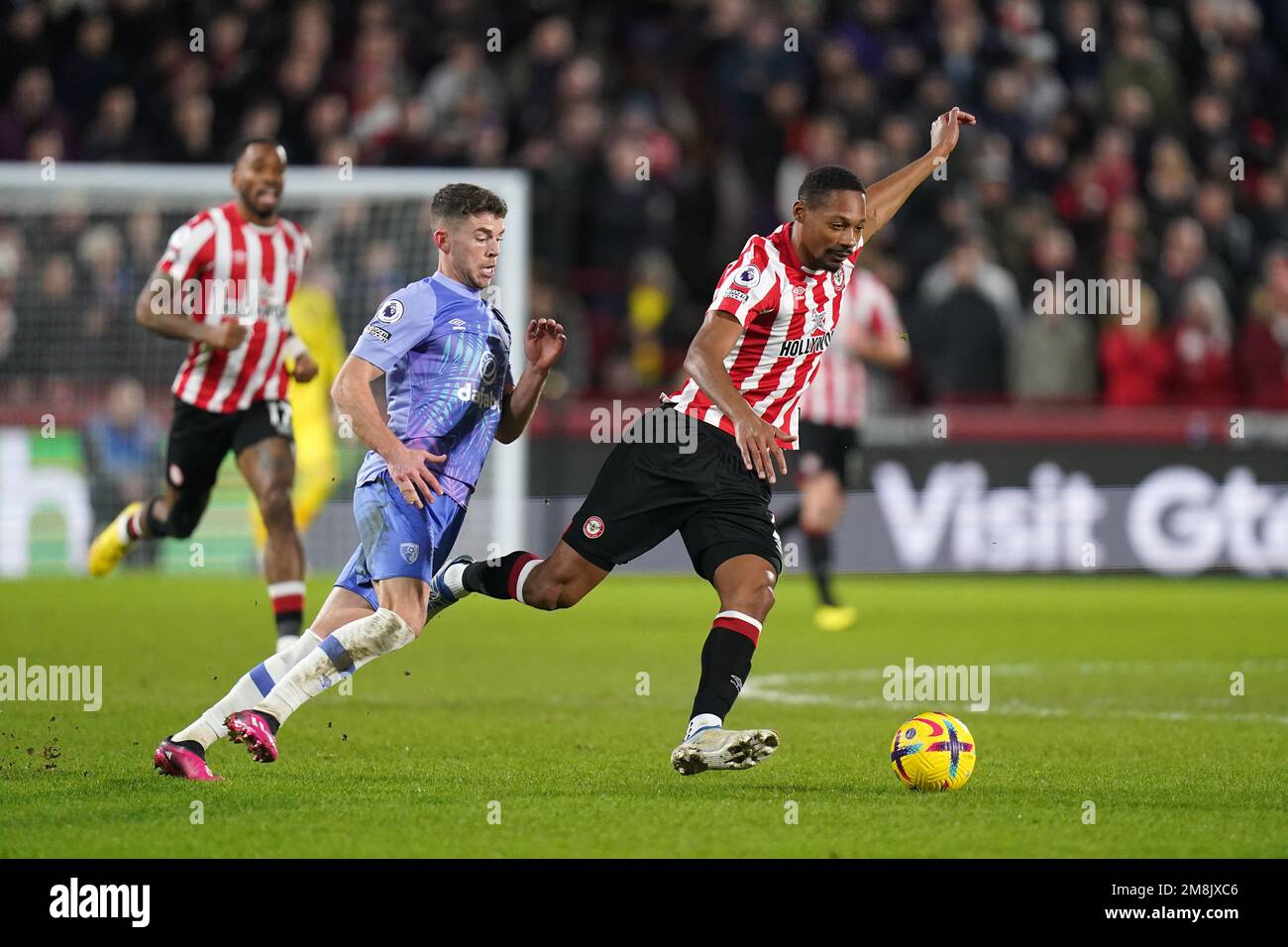 Bournemouth's Marcos Senesi (left) and Brentford's Ethan Pinnock battle ...