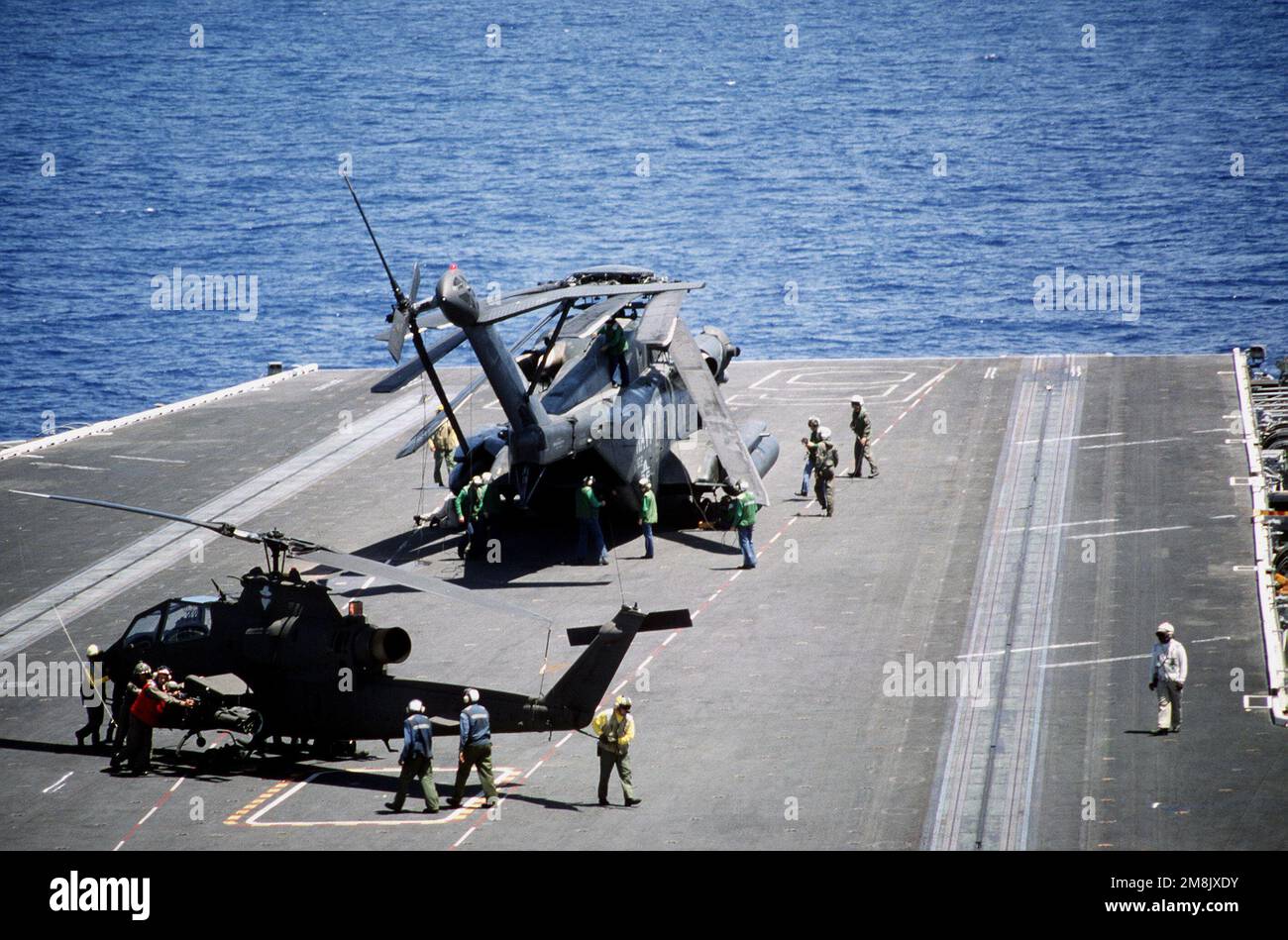 Flight deck crews on board USS DWIGHT D. EISENHOWER (CVN-69) re ...