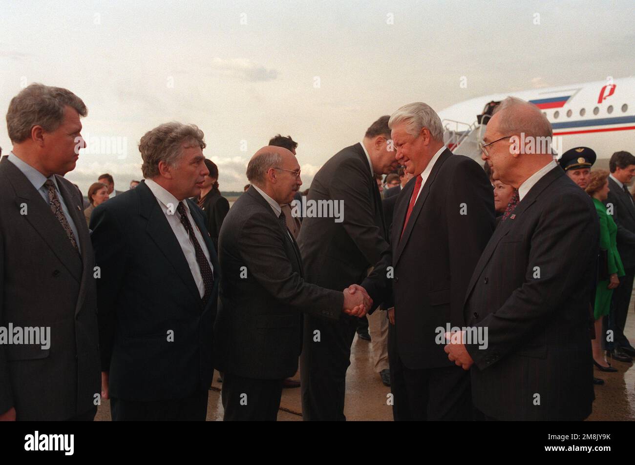 Russian President Boris Yeltsin says farewell to those on the flight ...