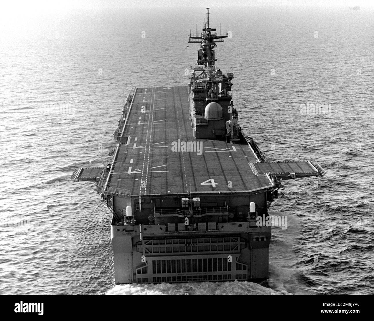 An aerial stern-on view of the amphibious assault ship USS BOXER (LHD-4 ...