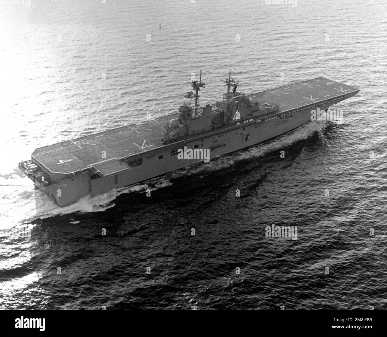 An aerial high oblique starboard quarter view of the amphibious assault ...