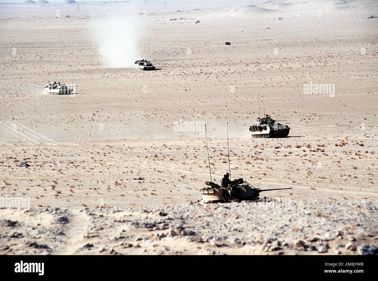 M2A2 Bradley Fighting Vehicles and M-1A1 Abrams tanks in formation ...