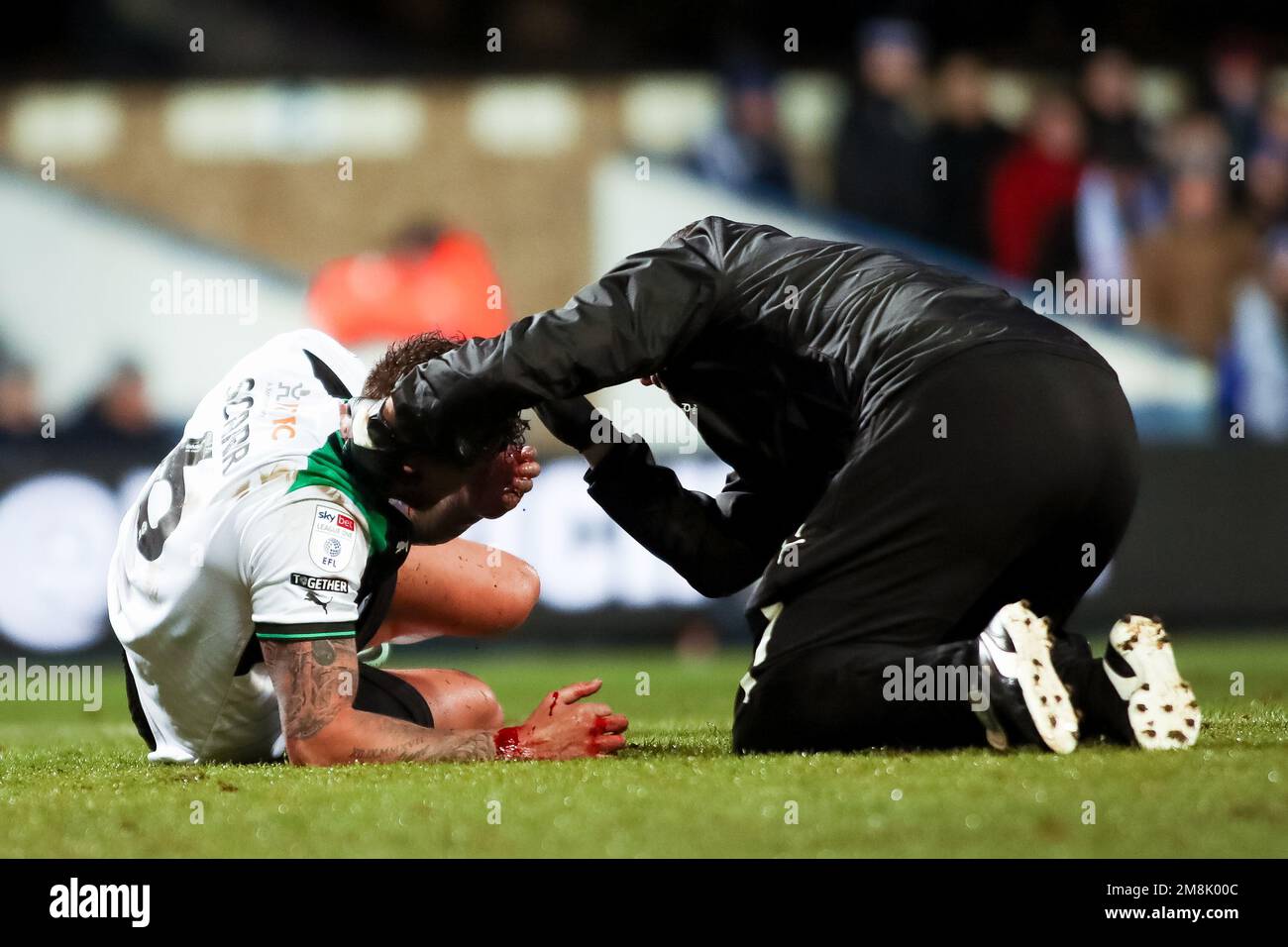 Plymouth Argyle's Dan Scarr receives medical attention during the Sky ...