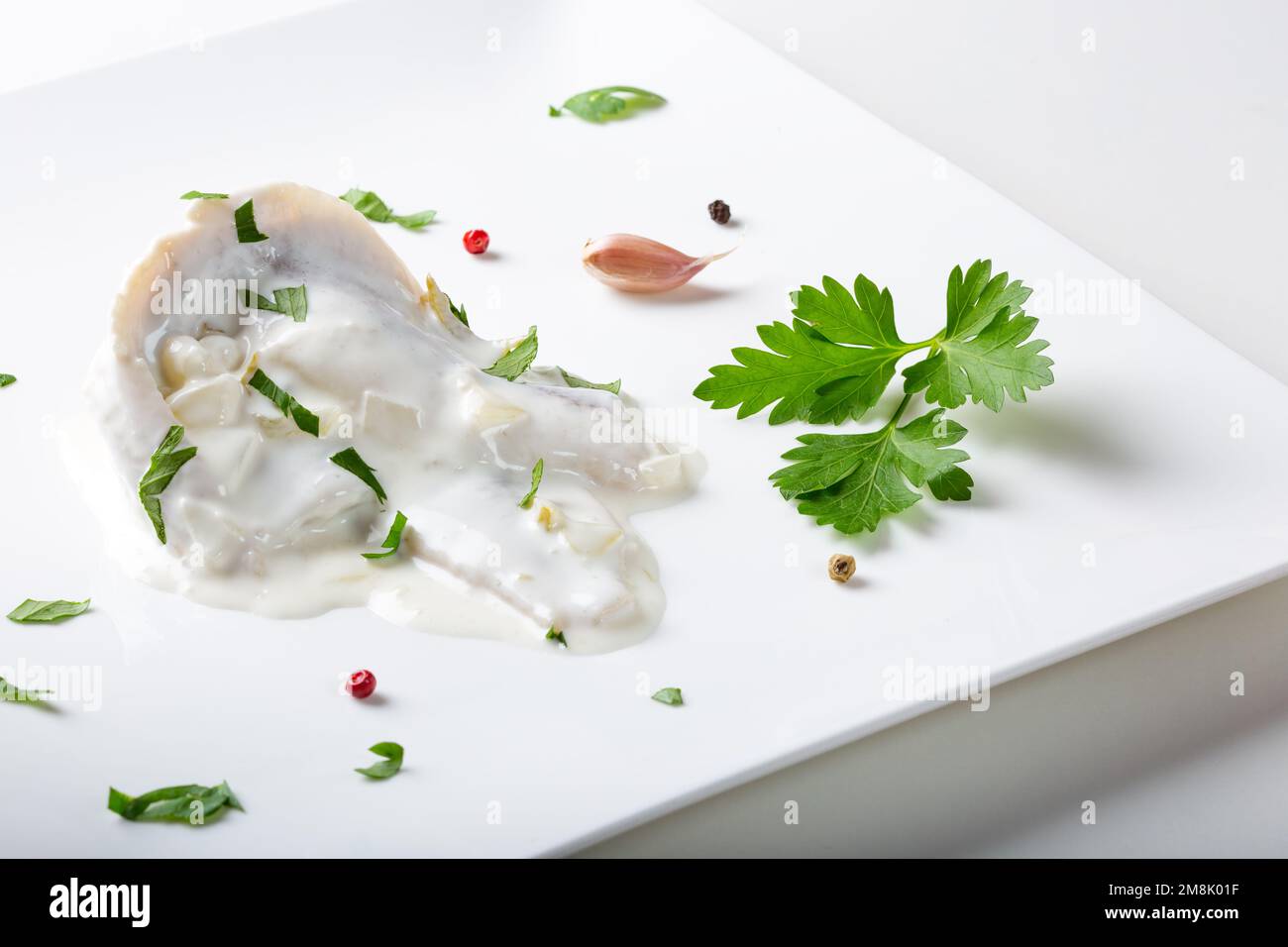 Herring in cream sauce hi-res stock photography and images - Alamy