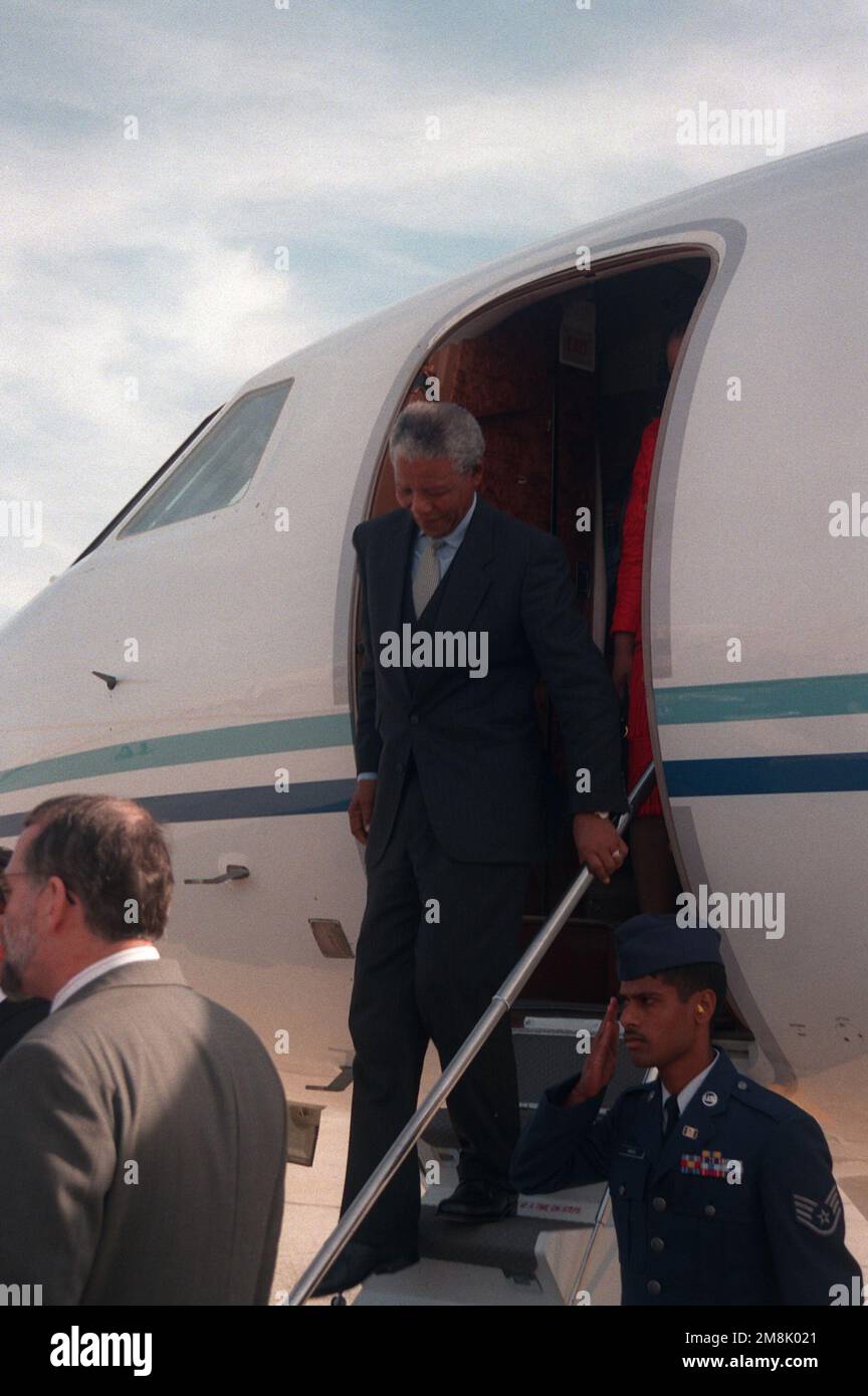 South Africa's President Nelson Mandela steps out the door of the ...