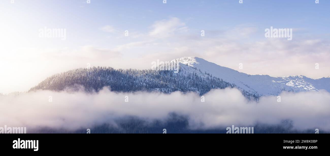 Snow and Cloud covered Canadian Nature Landscape Background Stock Photo ...