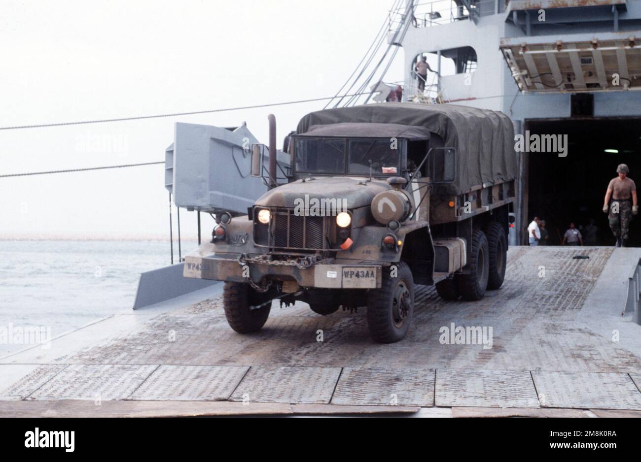 A US Army M939A2 5 ton truck rolls down the ramp of the Ready Reserve ...