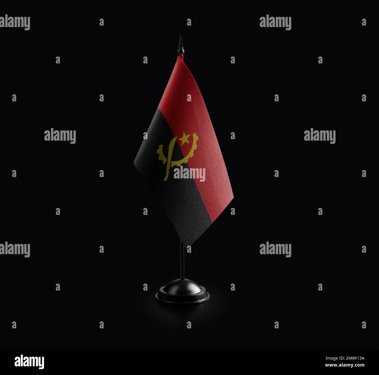 Small national flag of the Angola on a black background Stock Photo - Alamy