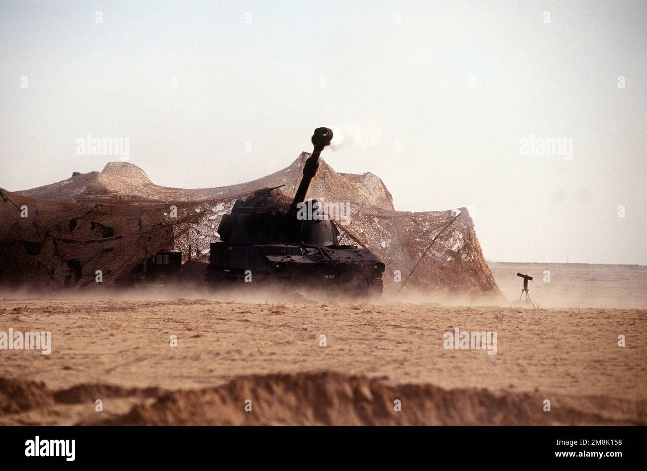 A M109AZ Self-propelled Howitzer is covered with desert camouflage ...