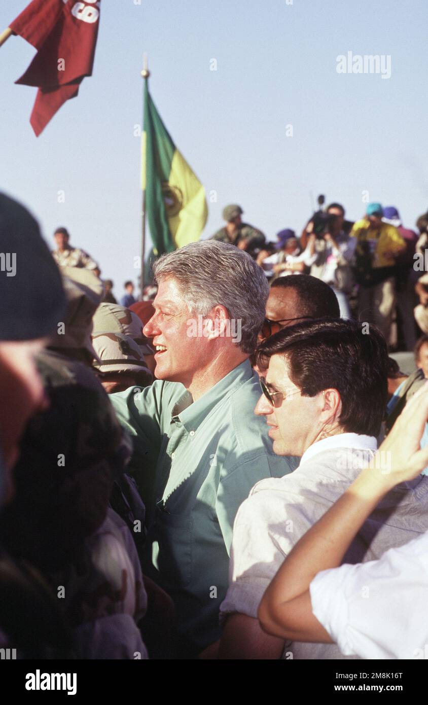 President William Jefferson Clinton shakes hands with US troops as he ...