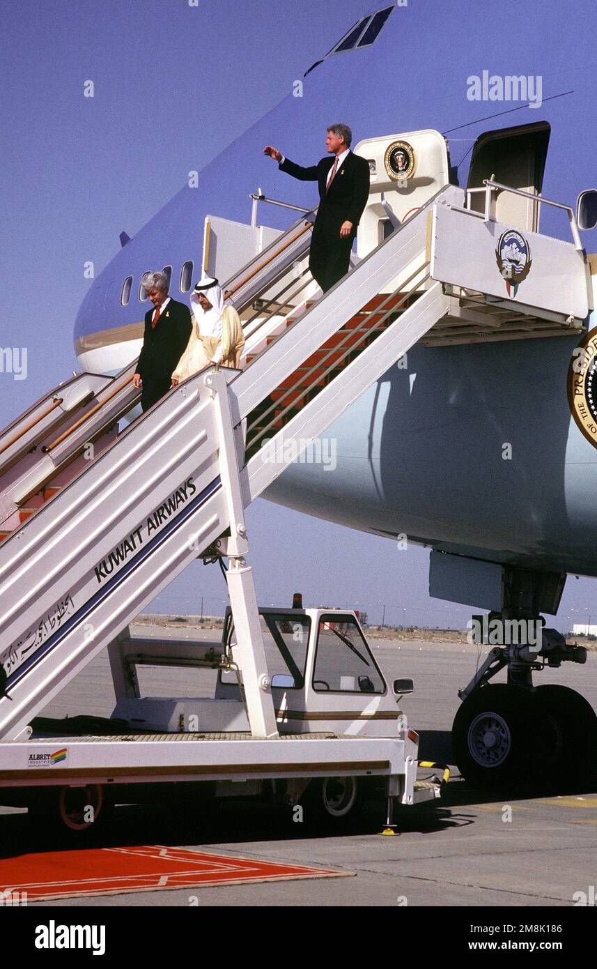 President William Clinton waves as he descends the steps of Air Force ...