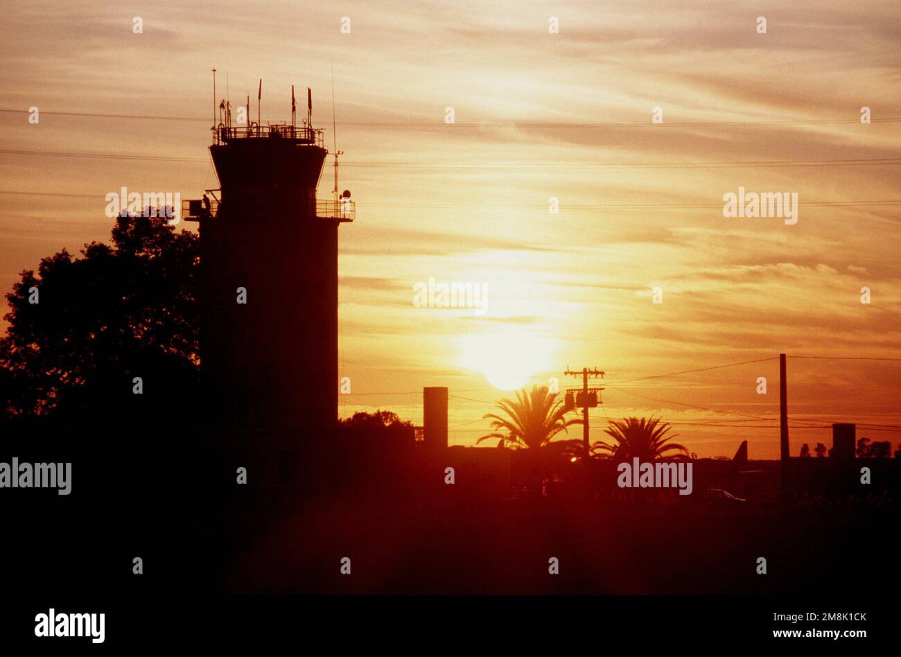 A silhouette of the tower on the flightline of the air base.(Exact date ...