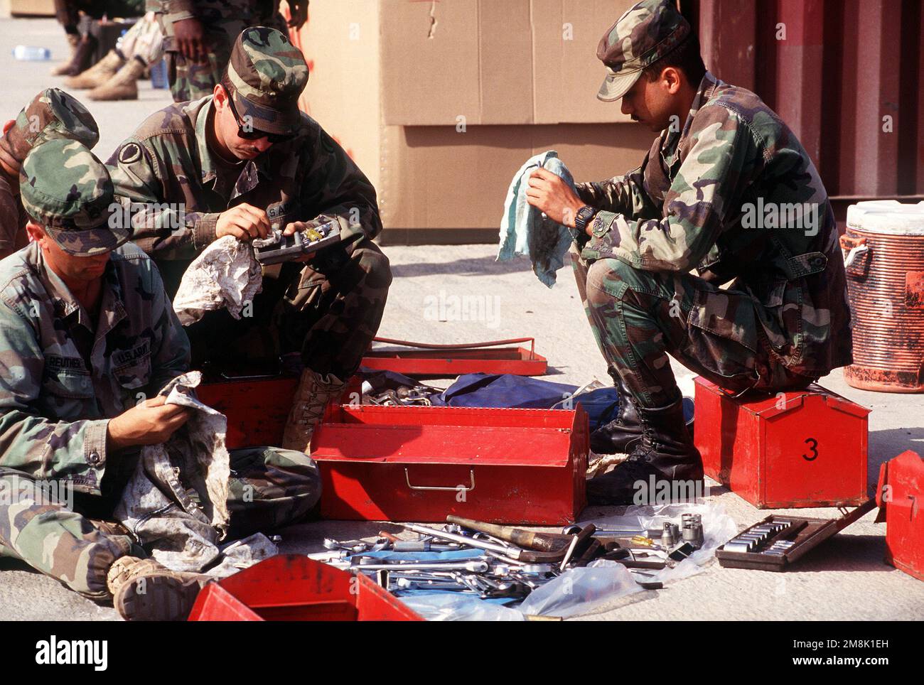 Soldiers from the 24th Infantry Division clean and inventory equipment ...