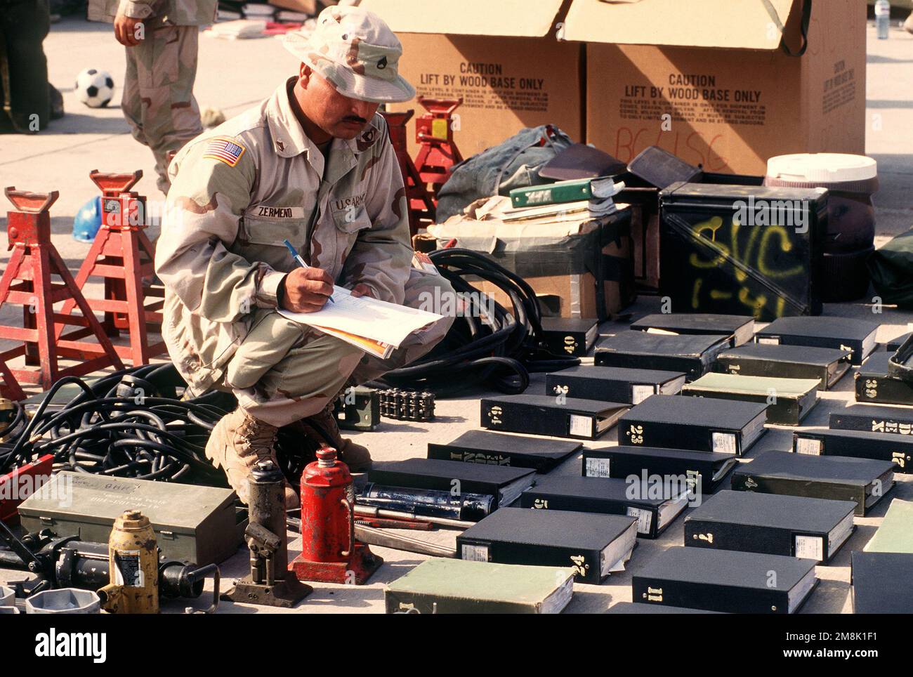 A soldier from the 24th Infantry Division inventories equipment at the ...