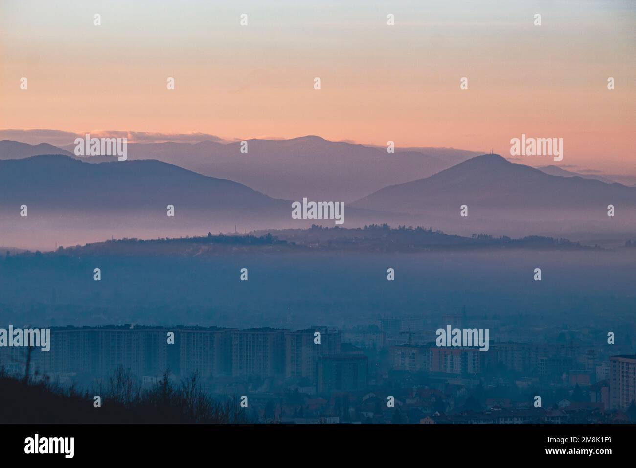 A landscape view of the mountains and hills against a blue sky in ...