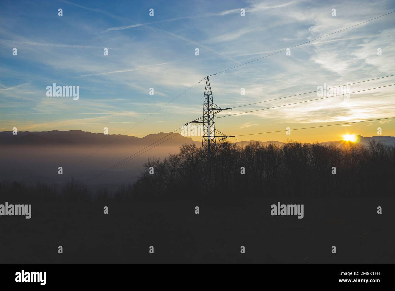 The communications tower with hills in the background at sunset Stock ...