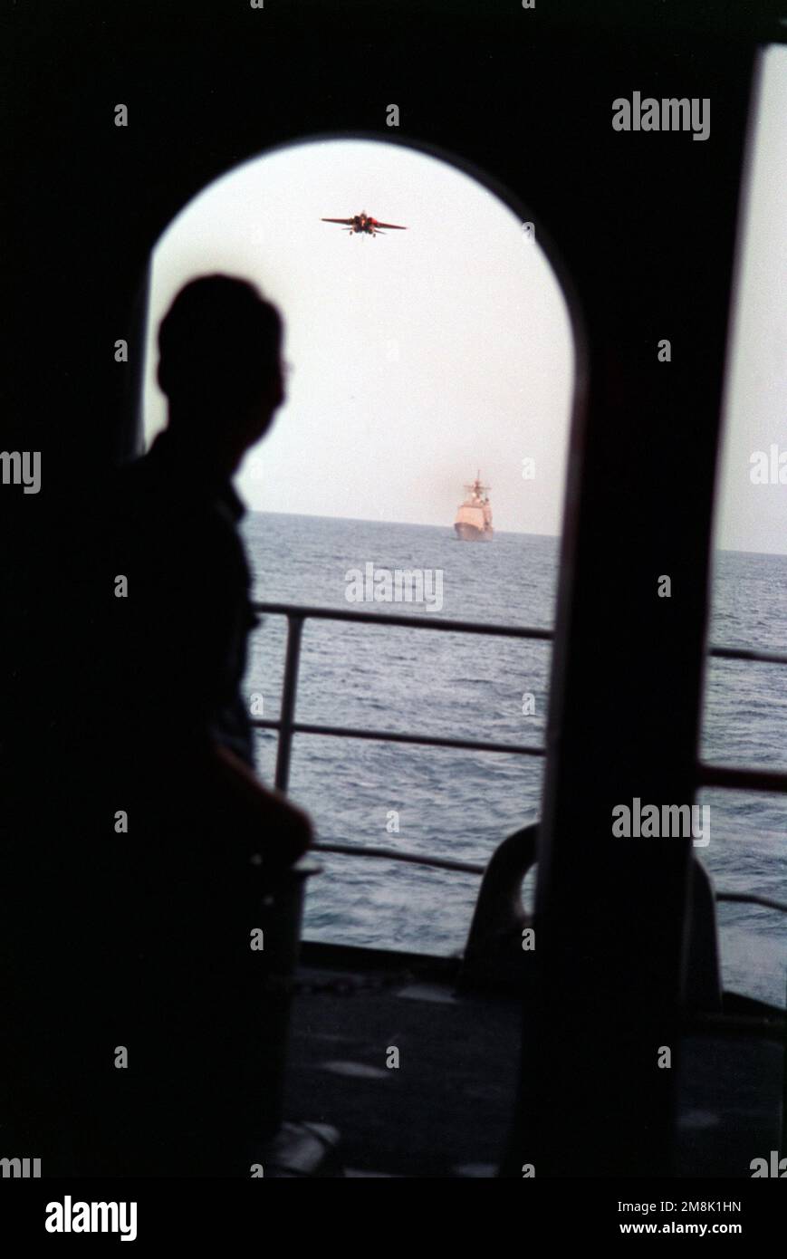 Machinist Mate First Class (MM1) Jeffrey S. Randell looks out from the ...