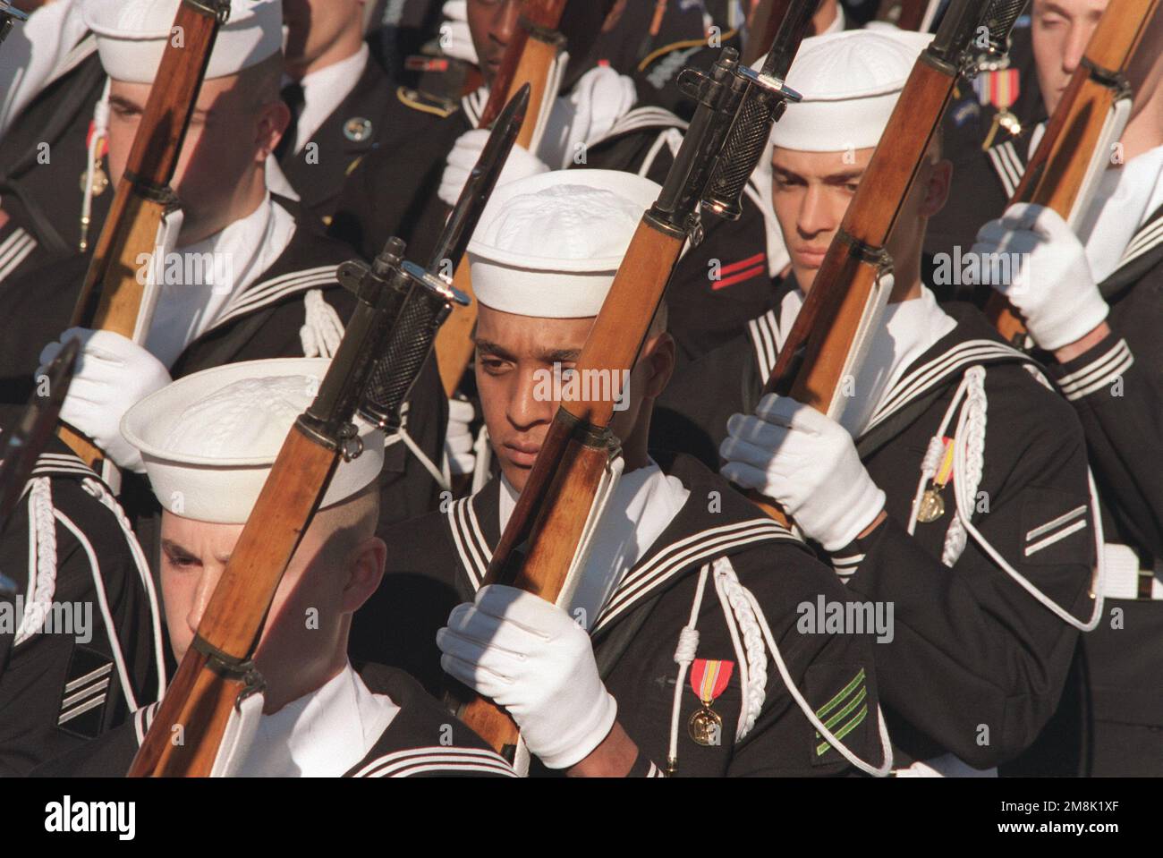 Front view of the Navy Ceremonial Honor Guard marching in formation ...