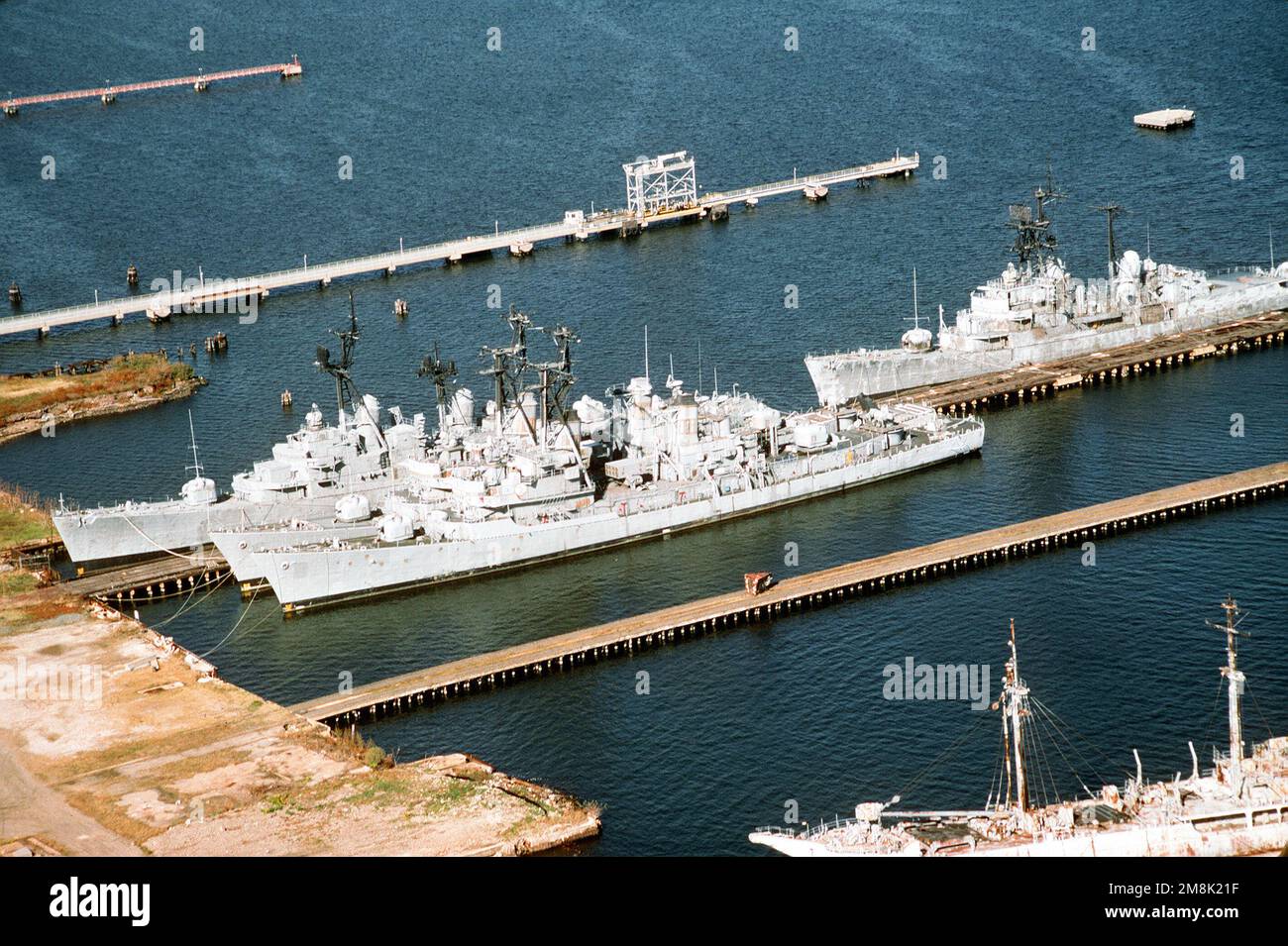 An aerial port bow view of a nest of former U.S. Navy destroyers ...