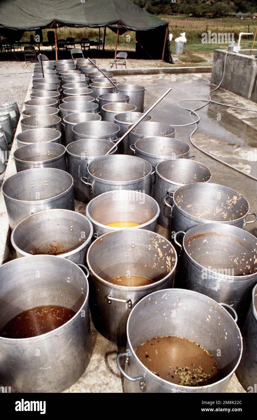 Dirty pots line up for cleaning after the lunch meal for the Cuban ...