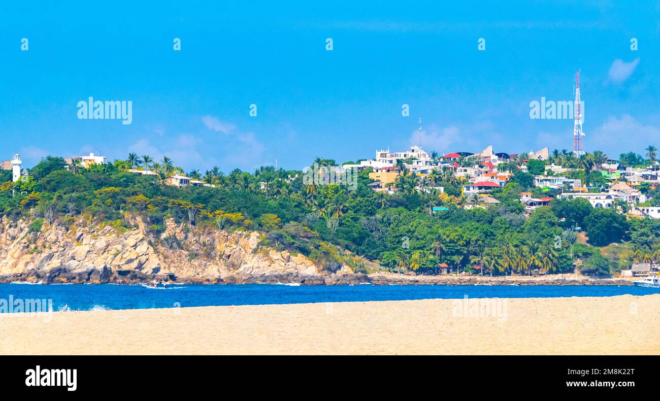 Beach sand blue water rocks cliffs and huge big surfer waves on the ...