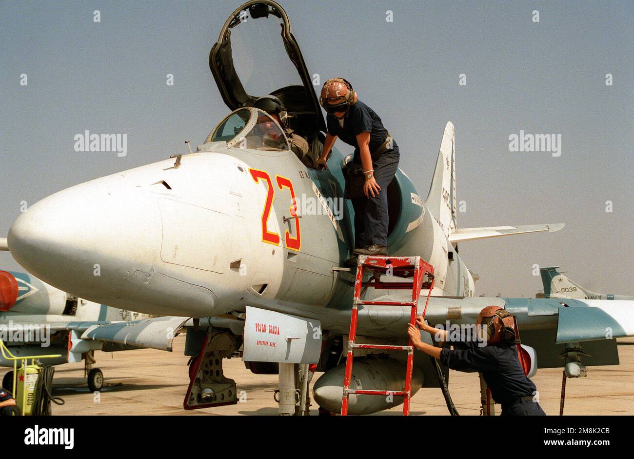 Plane captains for Fighter Squadron 126 (VF-126), perform preflight ...