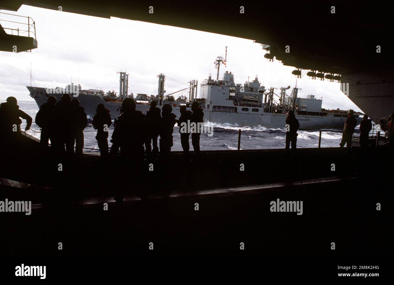 USNS PECOS (TAO 197) is framed by the opening of the hangar deck door ...