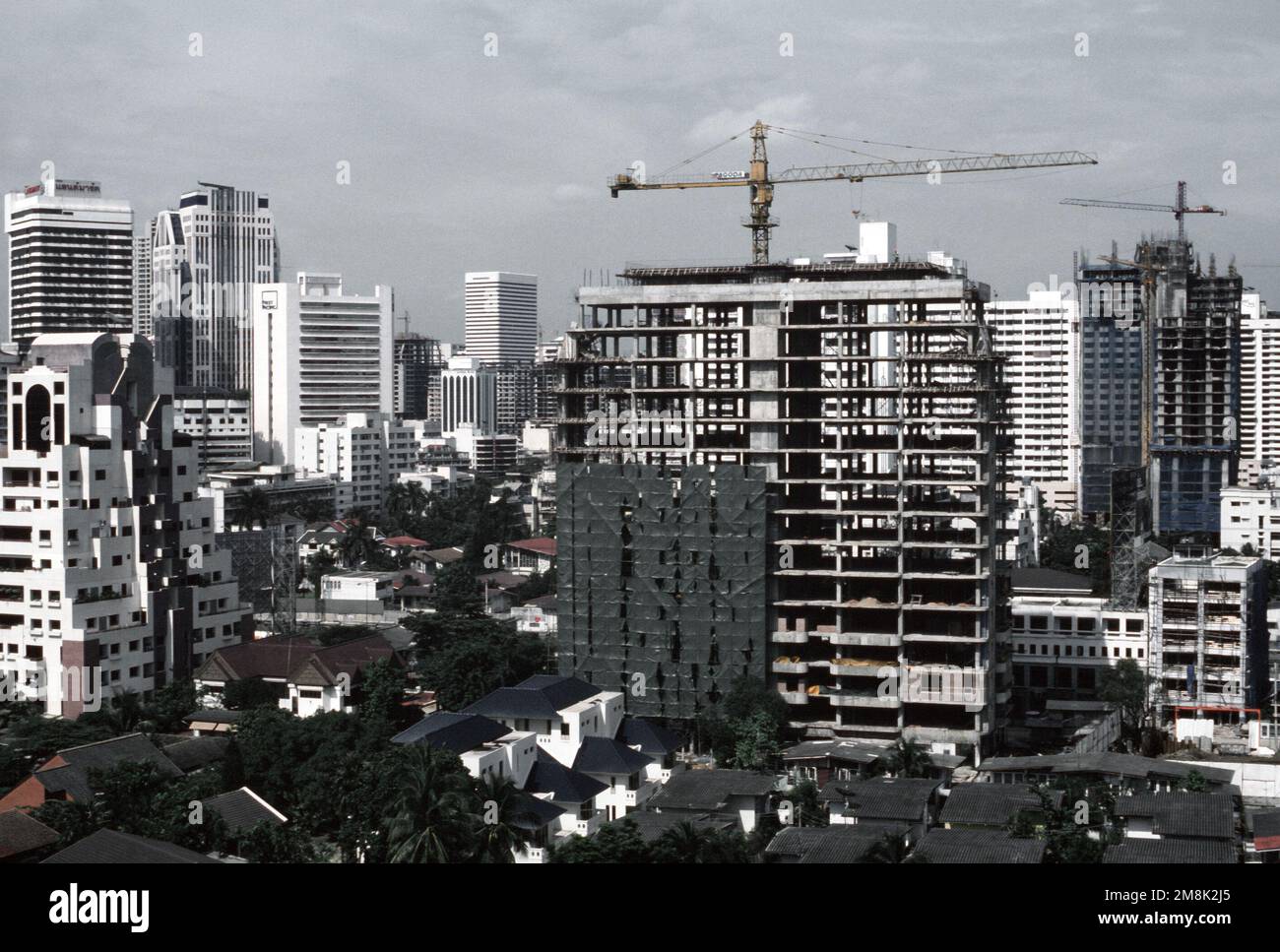 A view of Bangkok, Thailand's modern city skyline, the cranes atop the ...