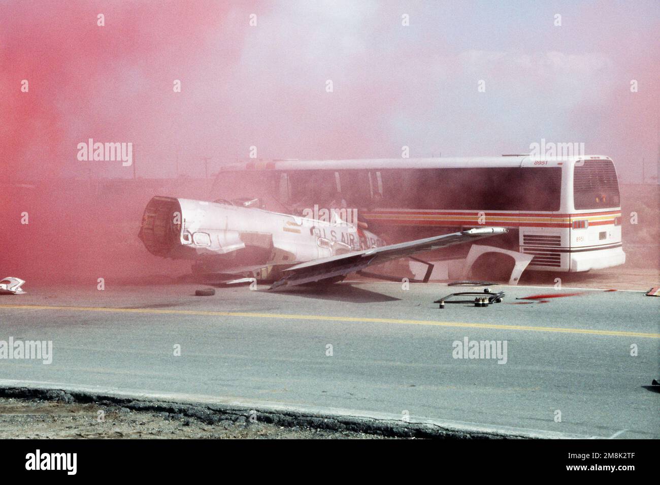 A view of the smoking aircraft and bus after a simulated crash of an ...