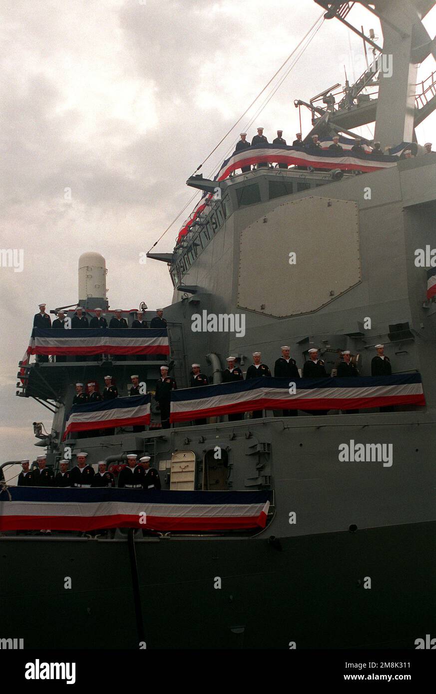 Crewmembers of the guided missile destroyer USS Mitscher (DDG-57) man ...