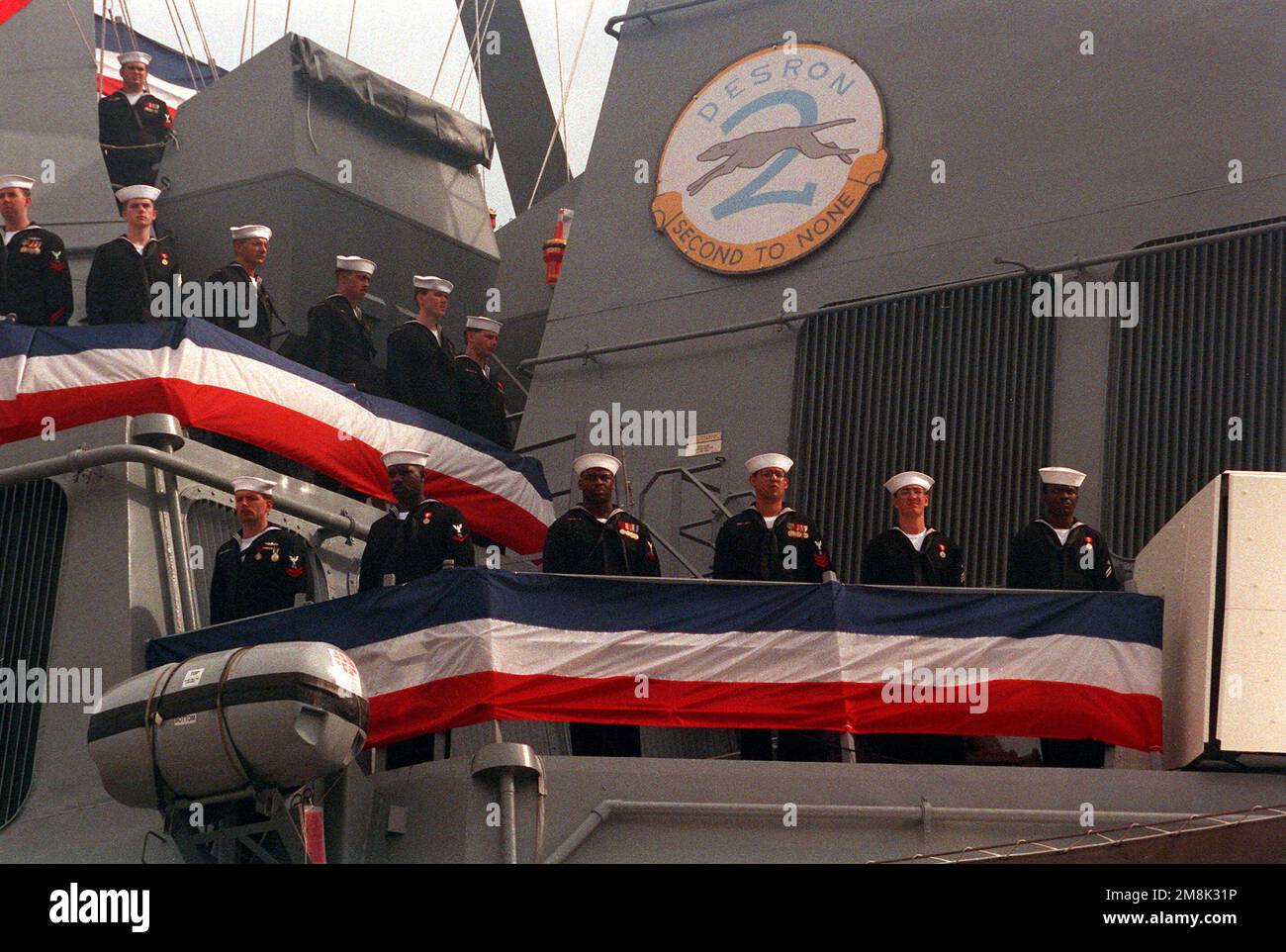 Crewmembers of the guided missile destroyer USS Mitscher (DDG-57) man ...