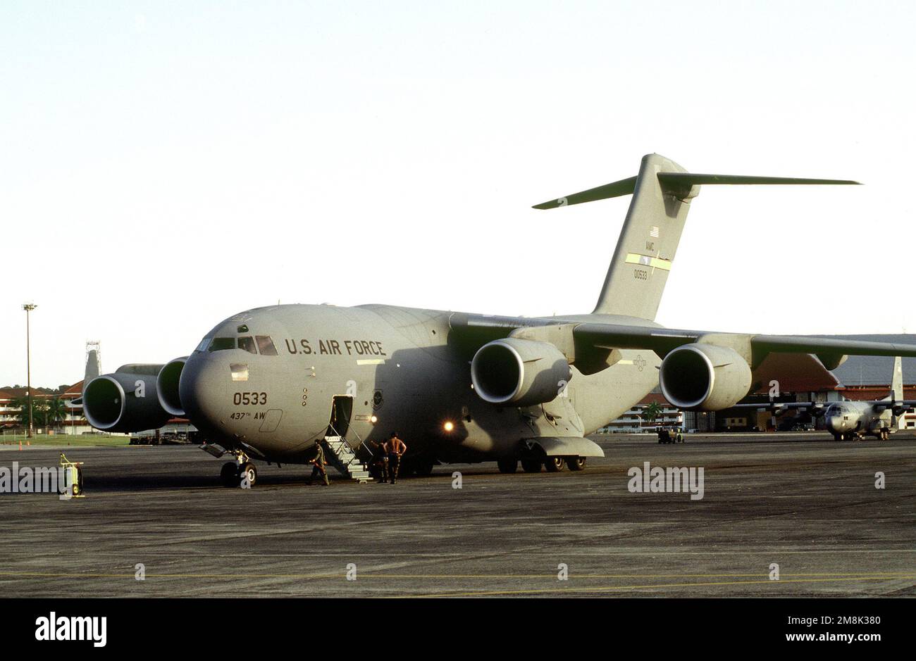 A left front view of a U.S. Air Force C-17 Globemaster III, attached to ...