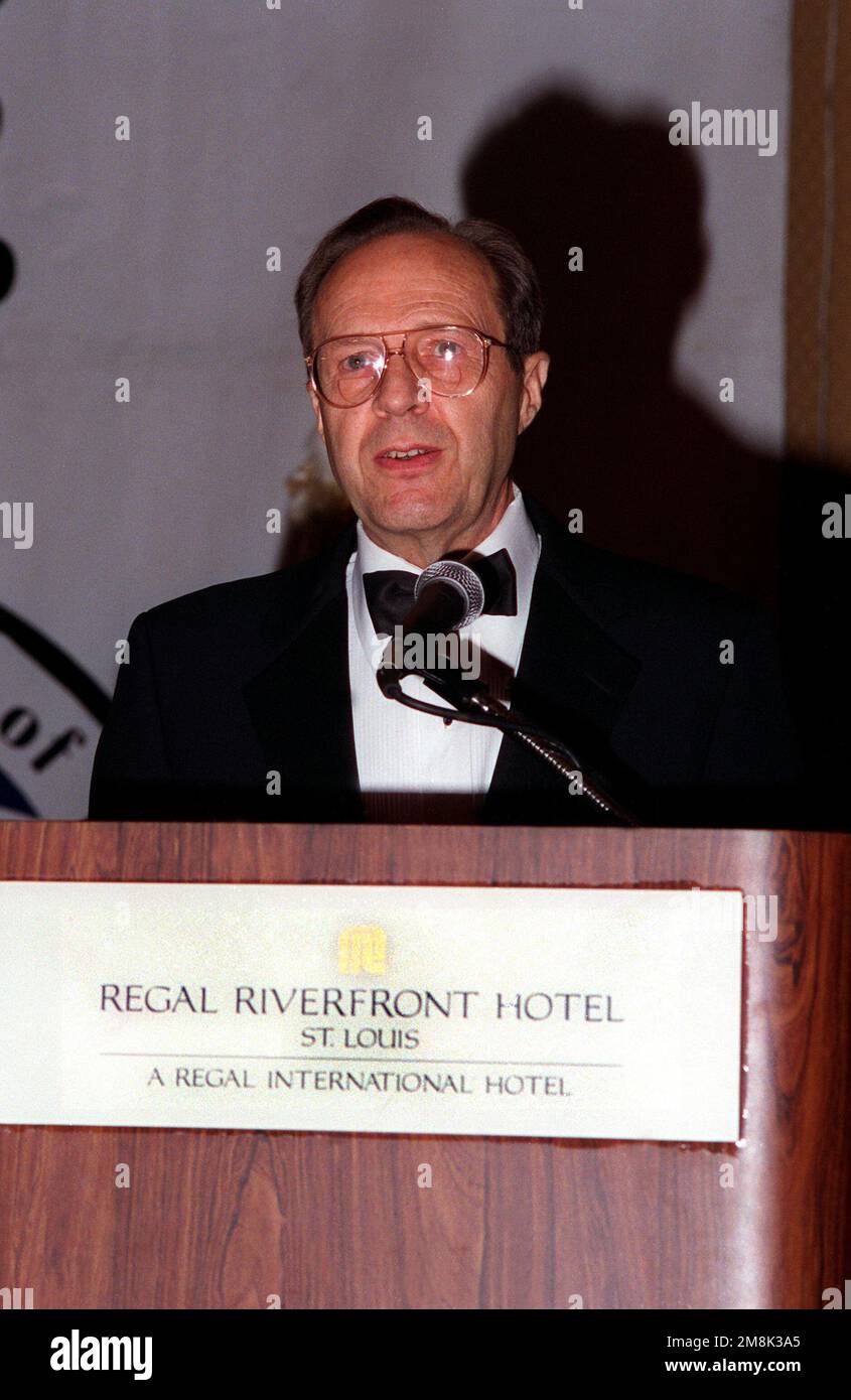 Secretary of Defense, William Perry, speaks at the podium at the Regal ...
