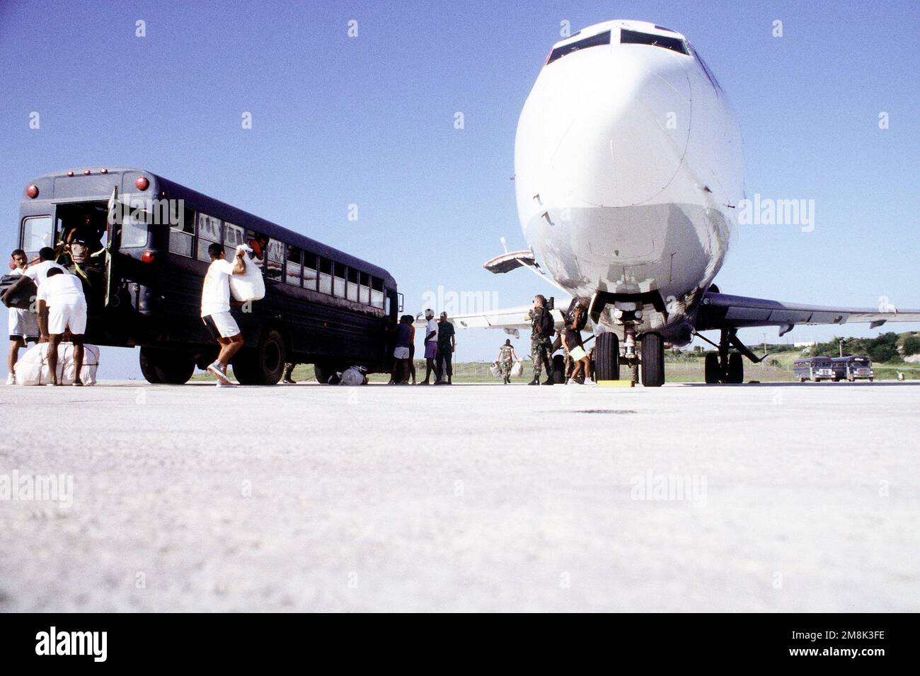 Cuban repatriates board the airplane that will take them home. The ...