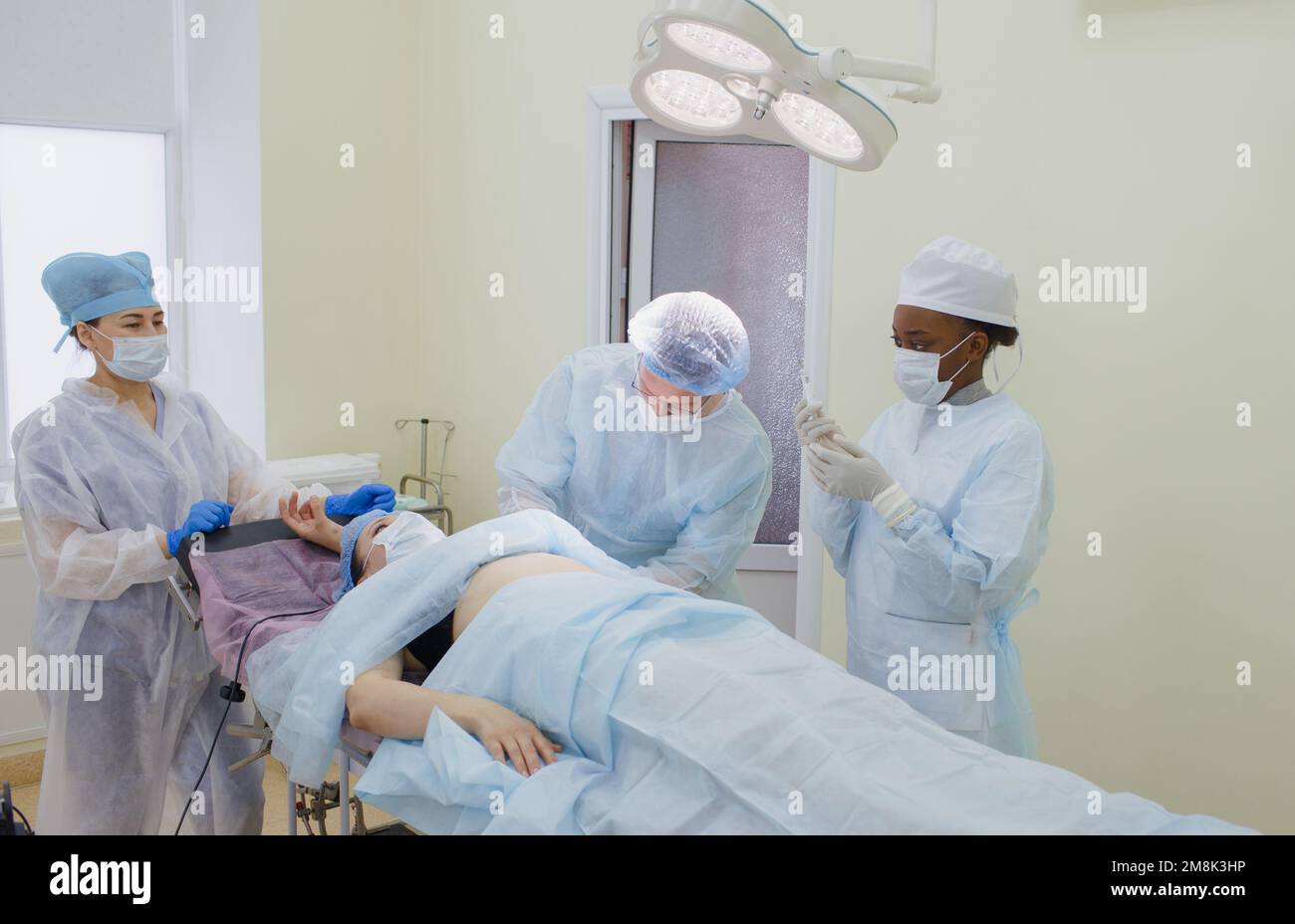doctors of the surgical unit prepare the patient for surgery Stock ...