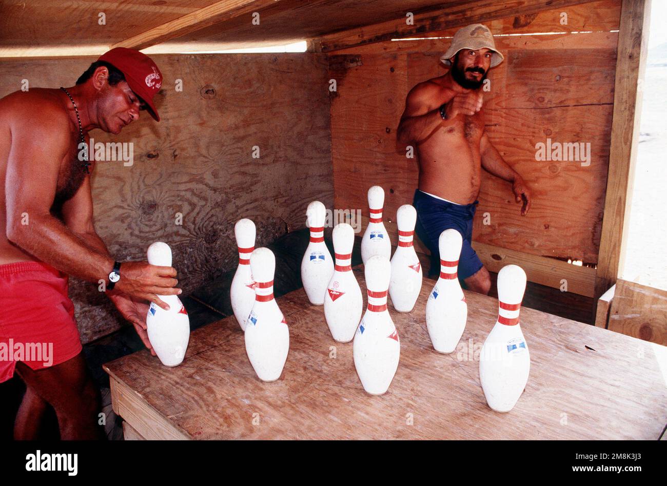 Cubans entertain themselves with a self built bowling alley. The camp ...