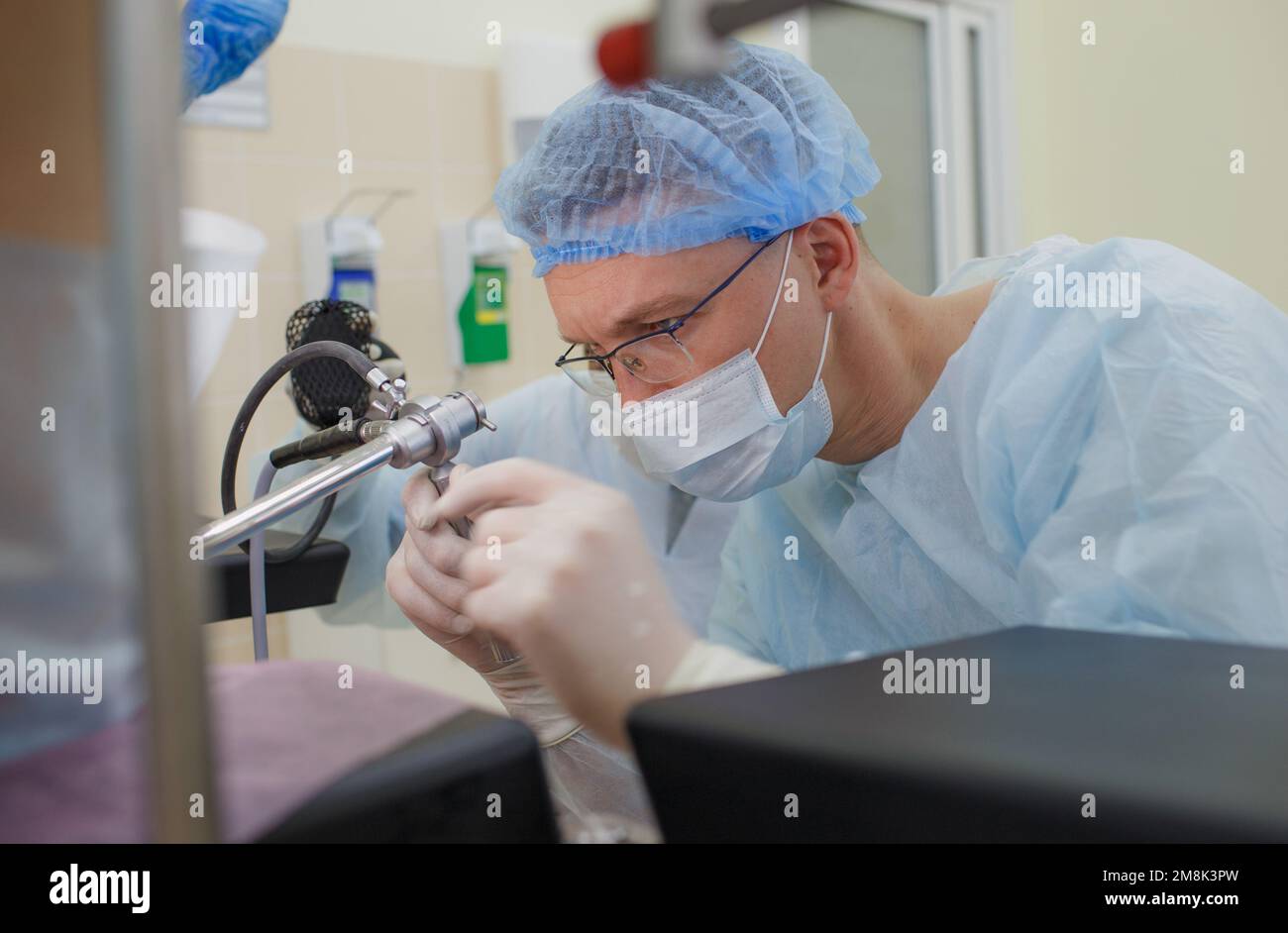 An experienced proctologist examines the patient using special devices ...